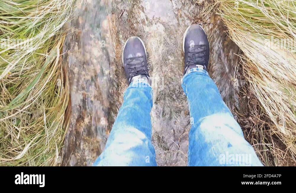 Standing in the water source on the edge of a cliff Stock Video Footage ...