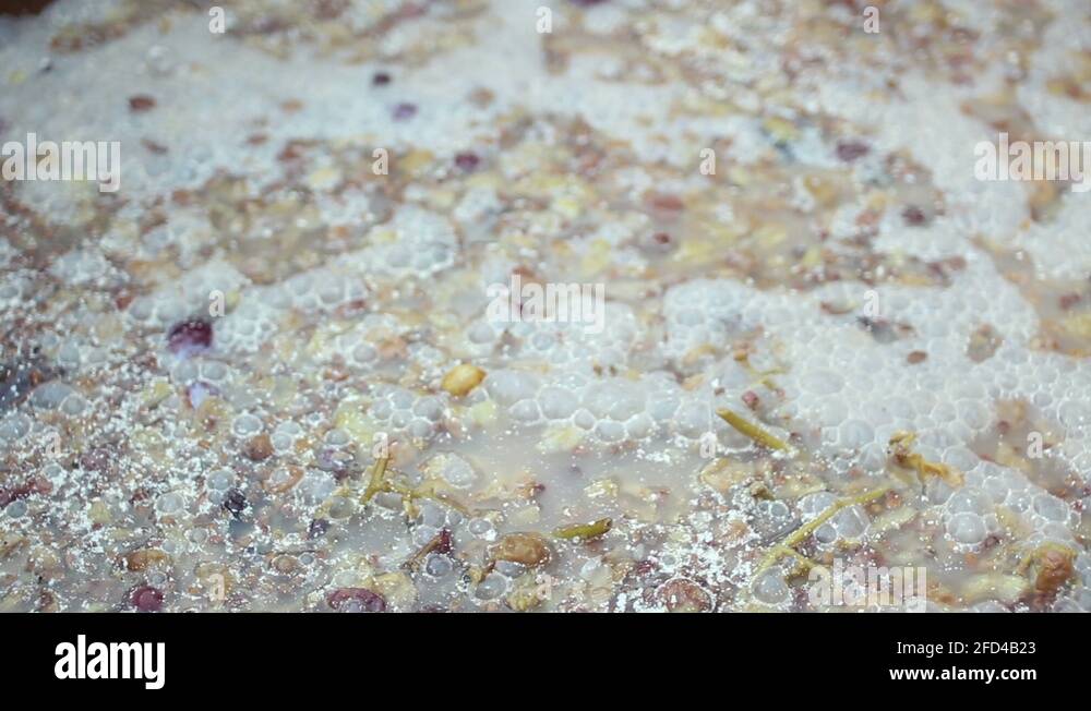 Traditional distillation of rakia (fermented fruit mixed with water and ...