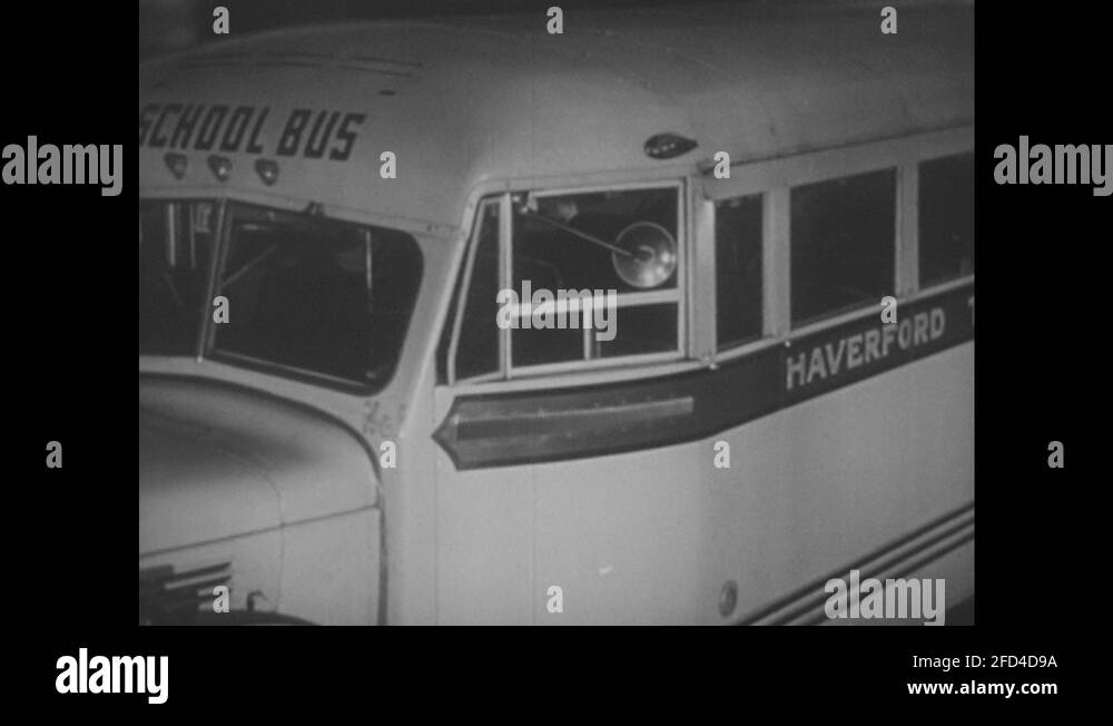 1940s: Side of school bus. School bus doors open. Rear of school bus ...