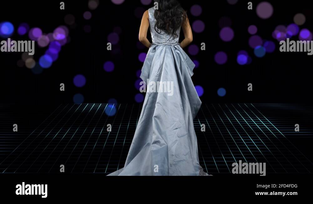 Miss beauty pageant winner steps across the stage with scrolling lights ...