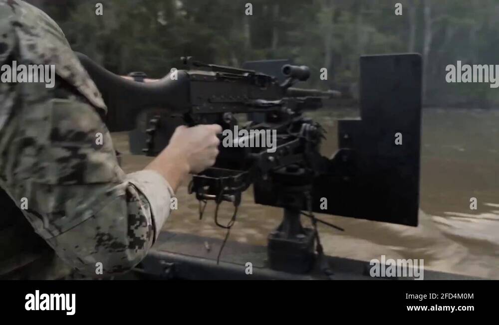 US Navy Special Warfare. Shoots With a machine gun on a boat Stock ...