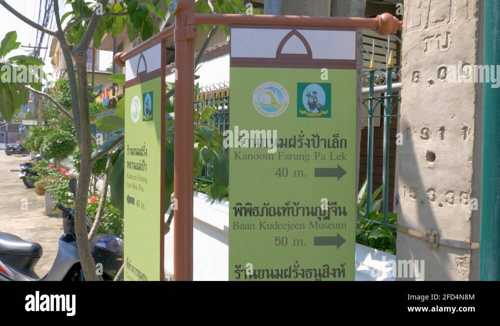 Signboard with directions to tourist attractions in Bangkok written in ...