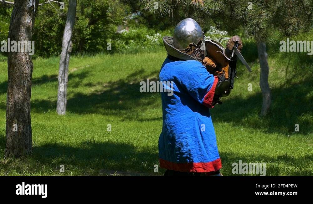 A knight makes a shield strike in the face of an opponent during a ...