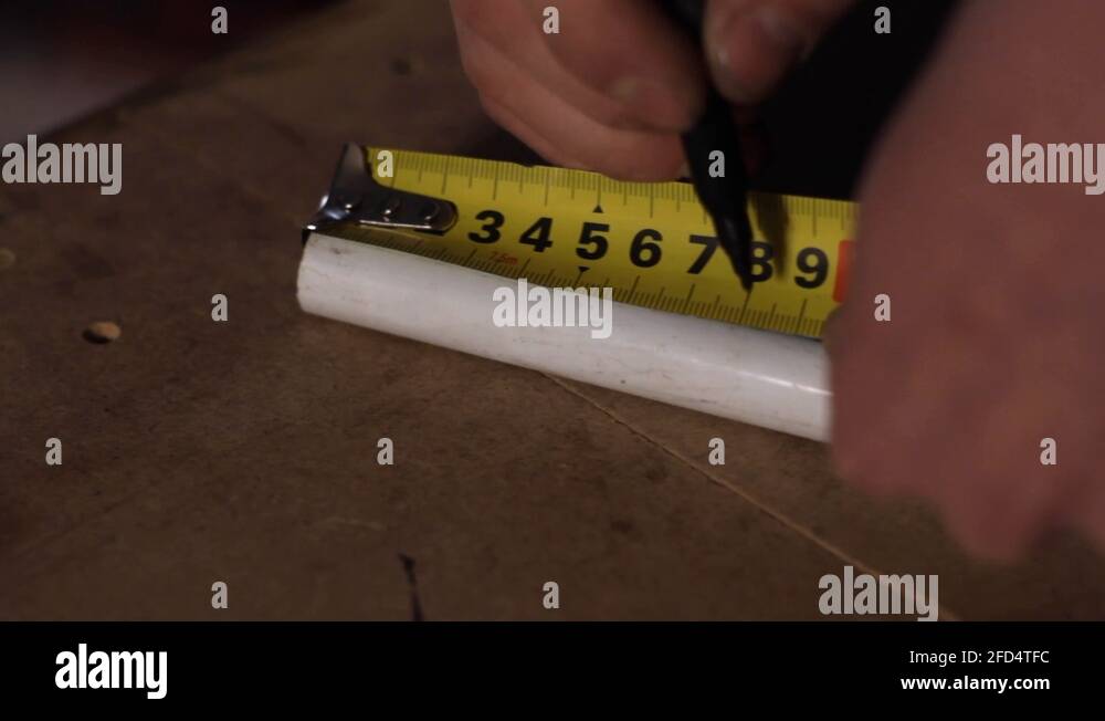 Measuring a pvc pipe fitting with a tape measure, closeup Stock Video ...