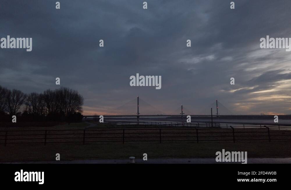 Sunrise waterfront British canal gates leading to river Mersey. Slow ...
