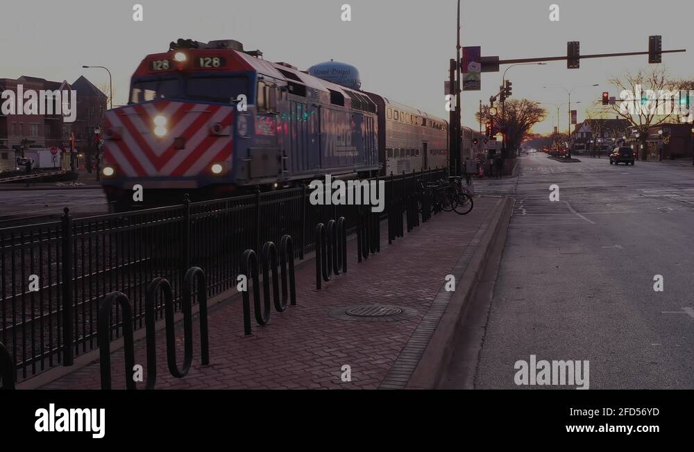 Metra Commuter Train Engine and Cars Leaves Mt, Prospect Station Stock ...