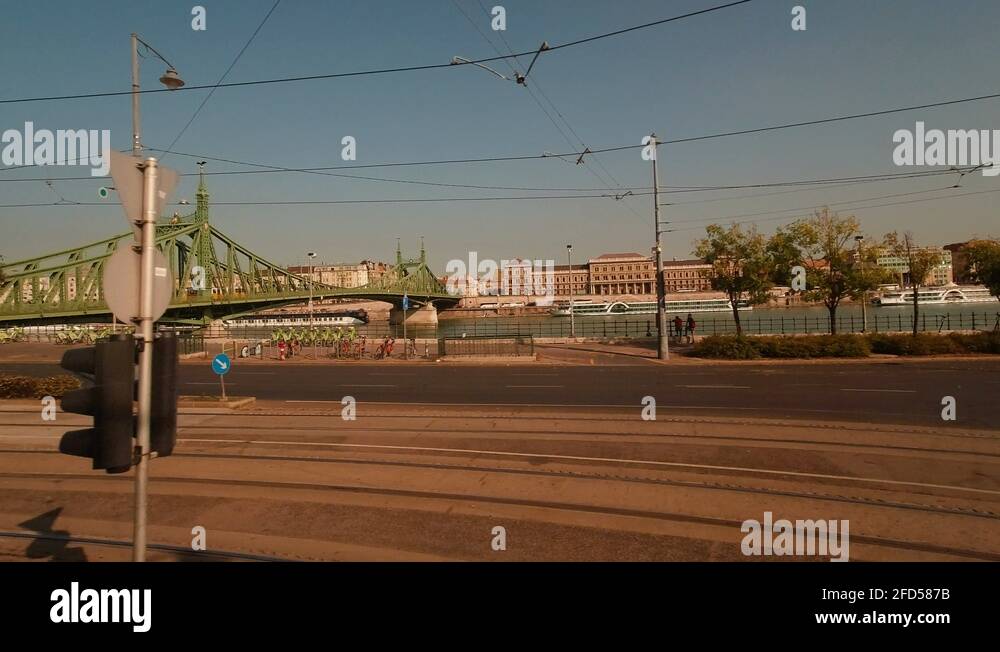 Driver point of view of bus turning back on city road and crossing ...