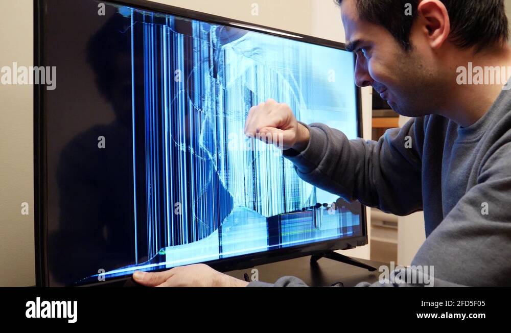 Frustrated Man With a Broken Damaged Television Screen Stock Video ...