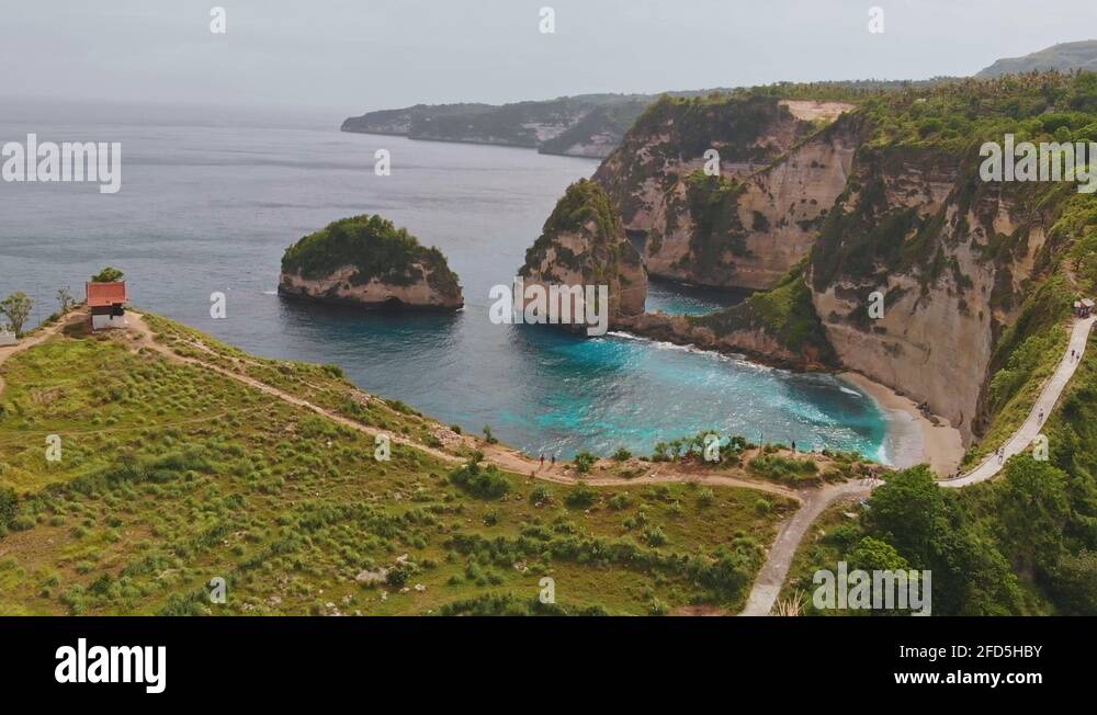 Drone fly above Atuh cliff edge, Diamond beach seascape, rocks in ...