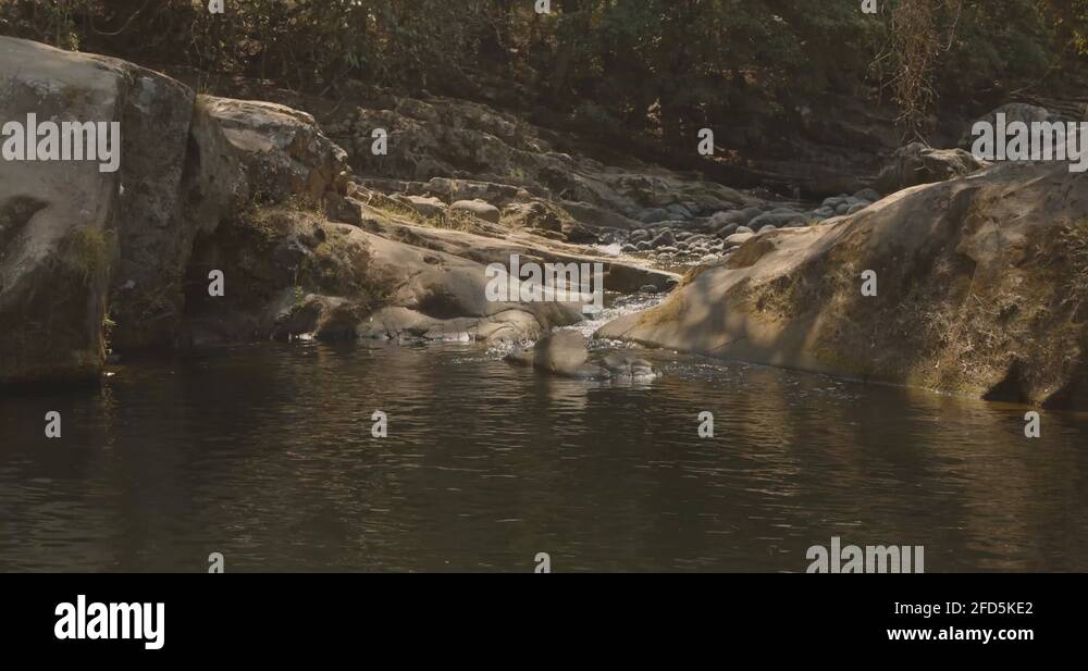 Water flowing into a shallow rock pool at Ladies Well, in the Hunter ...