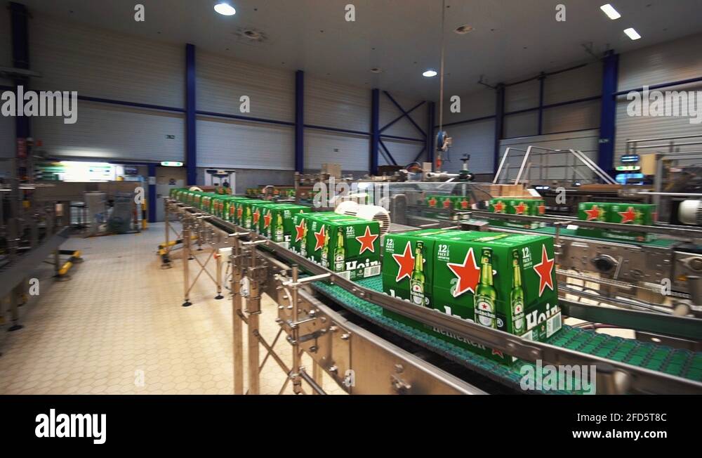 Heineken beer bottles on a conveyor belt in factory Stock Video Footage ...