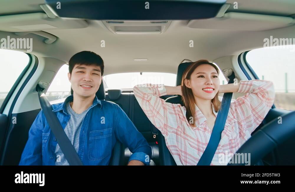 Couple ride self drive car Stock Video Footage - Alamy
