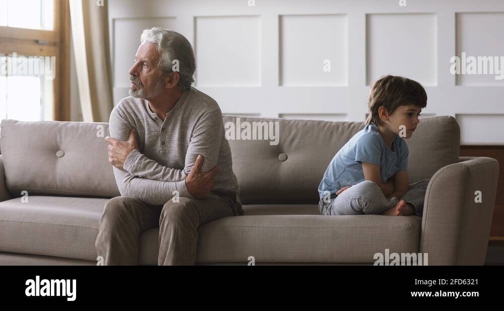 Upset old grandpa and kid grandson having generations conflict concept ...