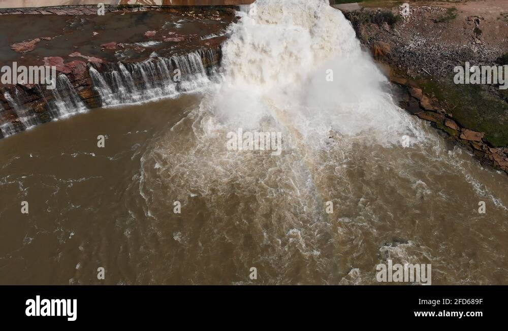 Drone Zooms Out, Tilts Up on Rainbow Dam, Missouri River, Birds Fly By ...