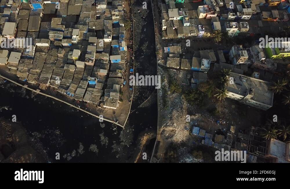 Cinematic Aerial View on Filthy River Canal and Dharavi Slum in Mumbai ...