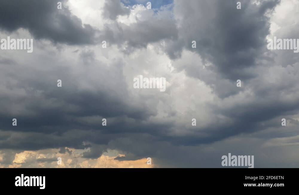 Scary dark hail storm clouds in sky with dense thick rain cloudsing ...