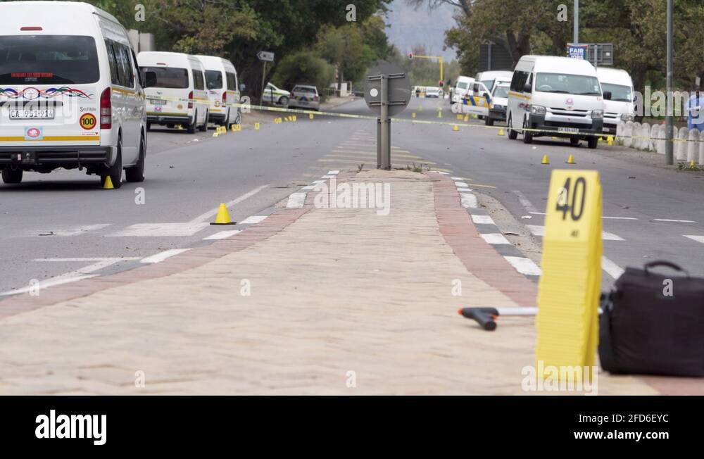 Police evidence markers at drive-by shooting crime scene in South ...