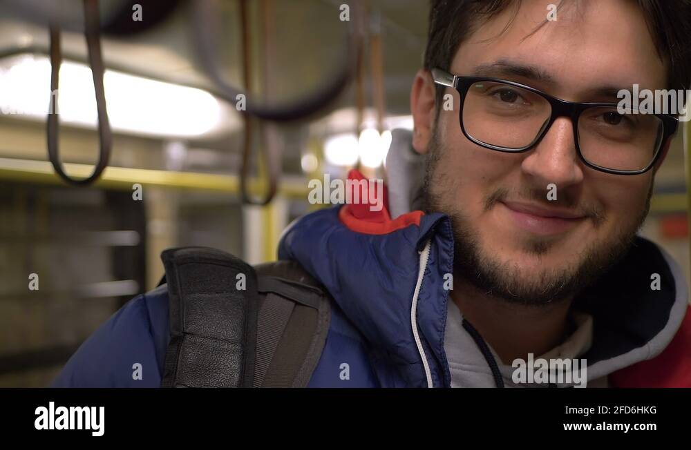 Man Commuting In Moving Metro Car, Smiling To The Camera, Happy ...