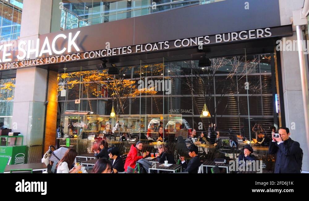 Shake Shack fast food restaurant in Tokyo city Japan, 4K panning left ...