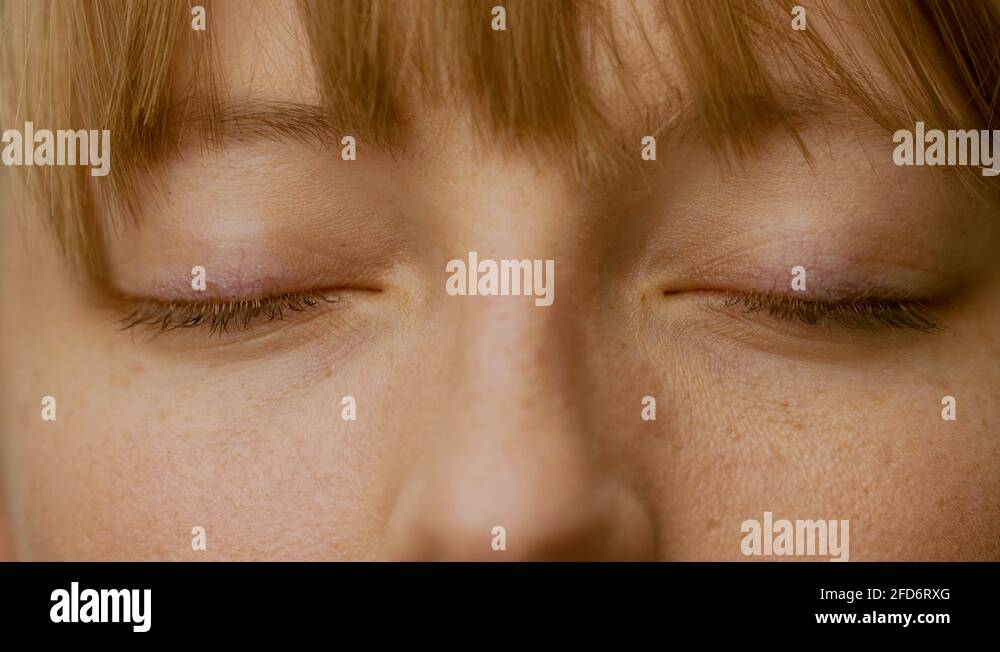 A Young Female Model Showing A Serious Face With Eyes Slowly Blinking ...