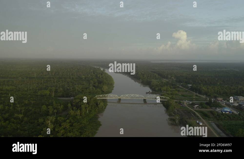 Huge white metal bridge over river connecting the two sides of village ...