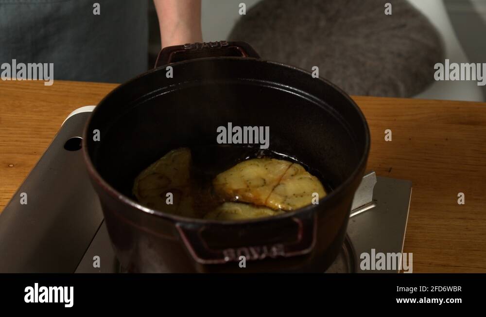 Turning off the fire for deep fried KAMONASU (Japanese round aubergine ...