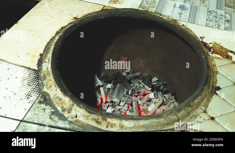 Start to make the first bread the traditional way, making the oven ...