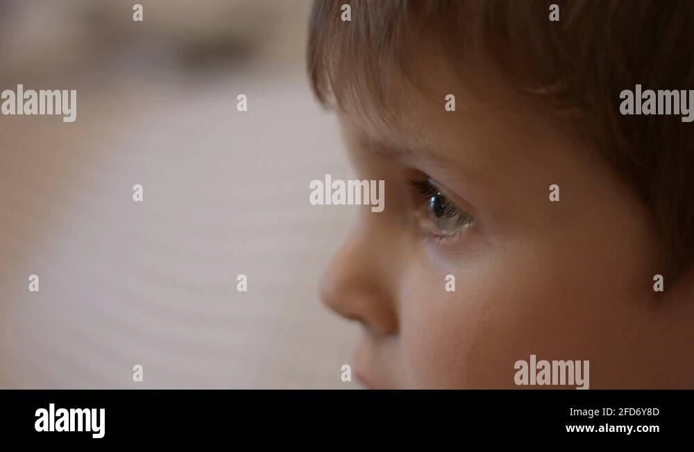 Baby face profile in slow motion. Toddler eyes and nose in profile ...