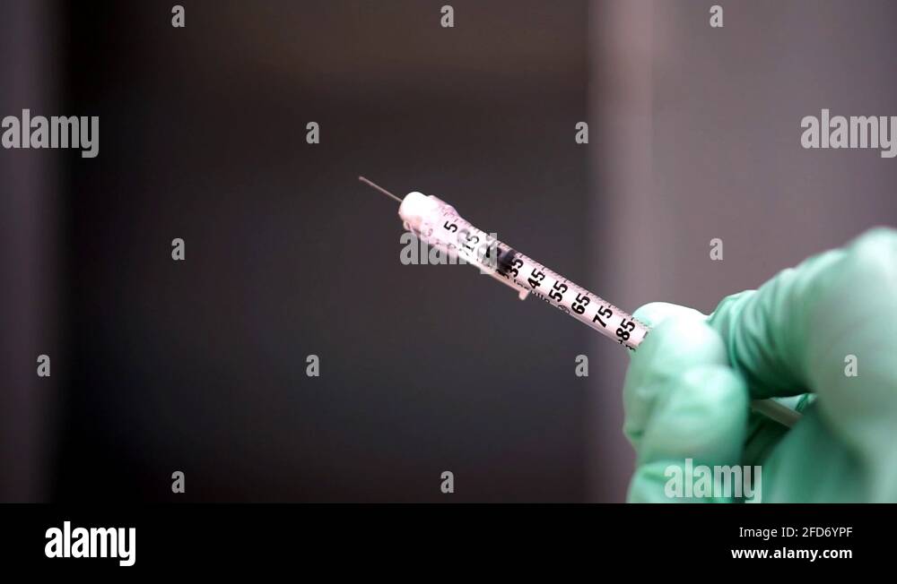 Generic concept of medication being injected out of a syringe Stock ...