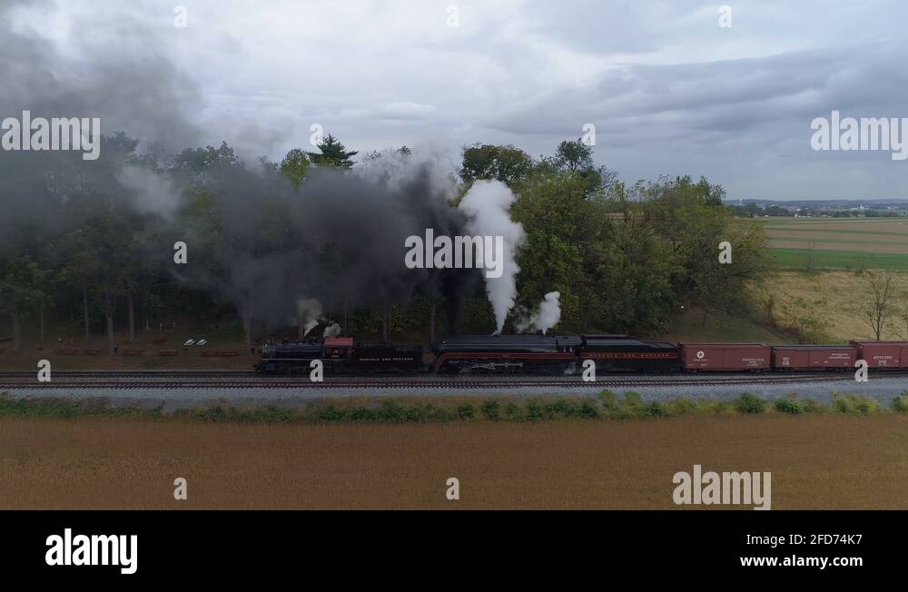 Aerial Side View of a Two Steam Locomotives Double Heading a Freight ...