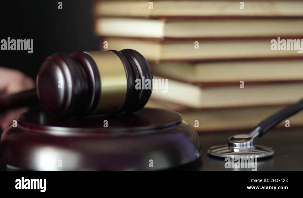 Judge's gavel and stethoscope. Judge hitting hammer three times Stock ...