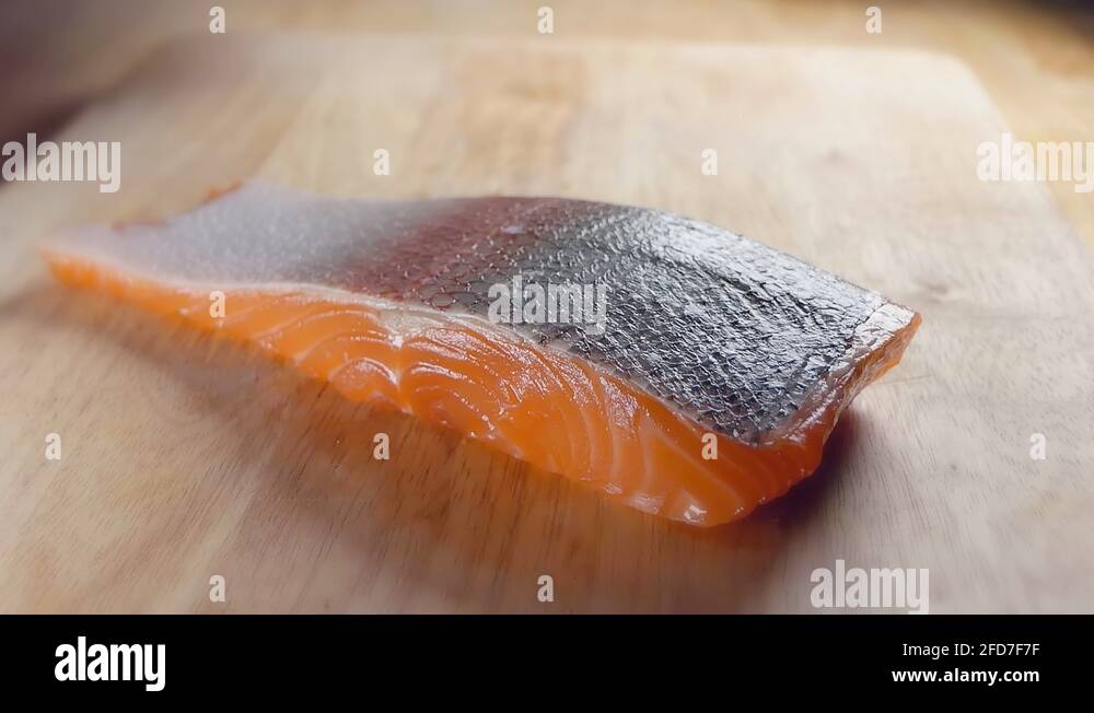 Close Shot of Scoring the Fish Skin on a Salmon Fillet Prior to Cooking ...
