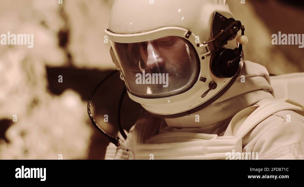 Close up of the male Caucasian NASA astronaut in the head armor looking ...