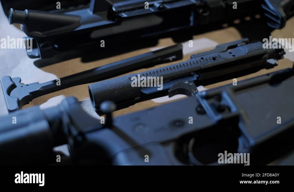 slow pan across disassembled ar-15 rifle in a pistol configuration. The ...