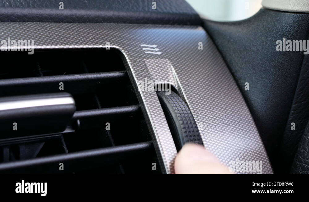 Motion of hand adjusting the air conditioner of the car with 4k ...