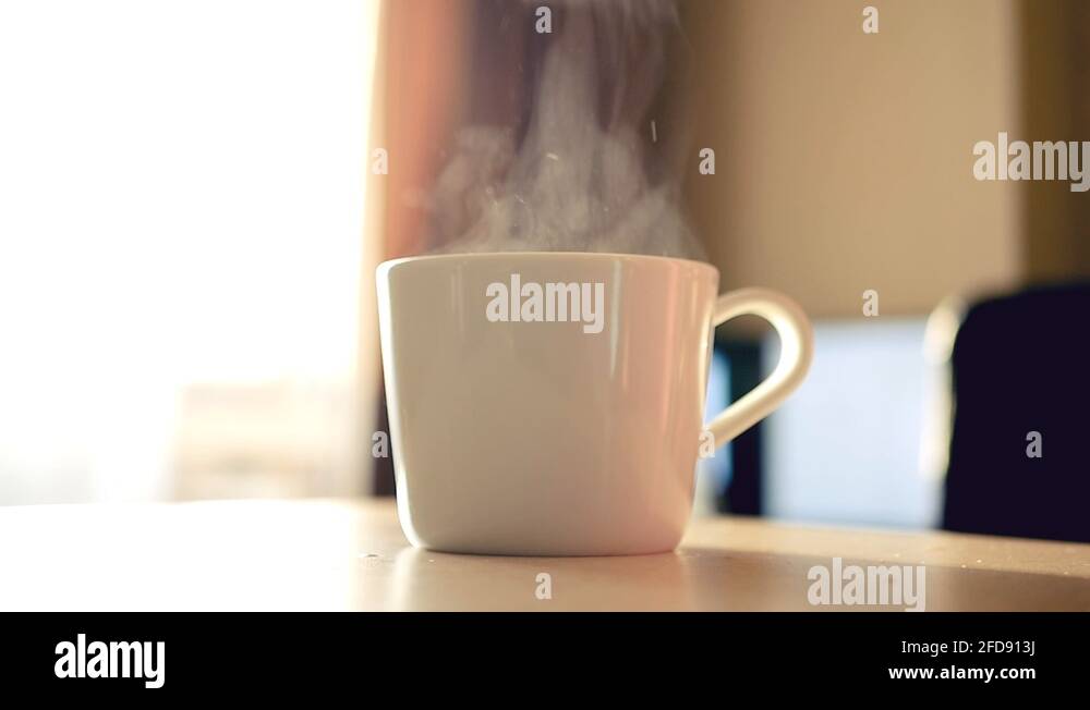 A cup of invigorating coffee with steam. HD, 1920x1080, slow motion ...