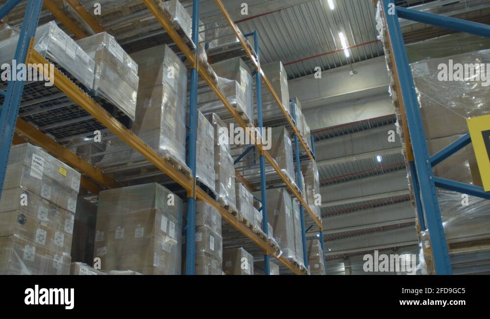 Tilt down of high rack in industrial warehouse Stock Video Footage - Alamy