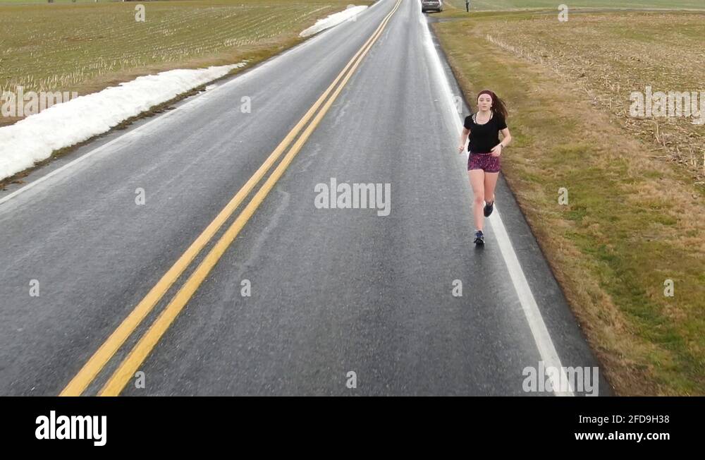 Girl running on country road Stock Videos & Footage - HD and 4K Video ...