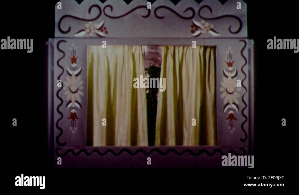 1950s: Stage curtain opens and puppets move. Puppet gestures. Clown ...