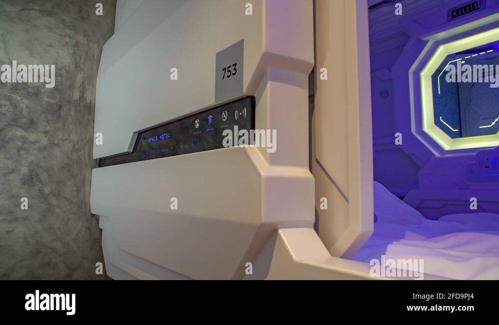 High-tech room in a mini-hotel room in capsule hotel open entrance hole ...