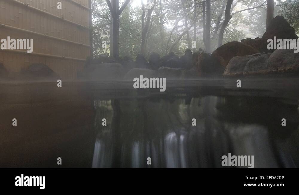 Water level view inside of typical outdoor Japanese hot springs bath ...