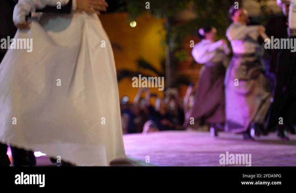 Profession Mexican folk dance troop dancing in 19th century costumes on ...