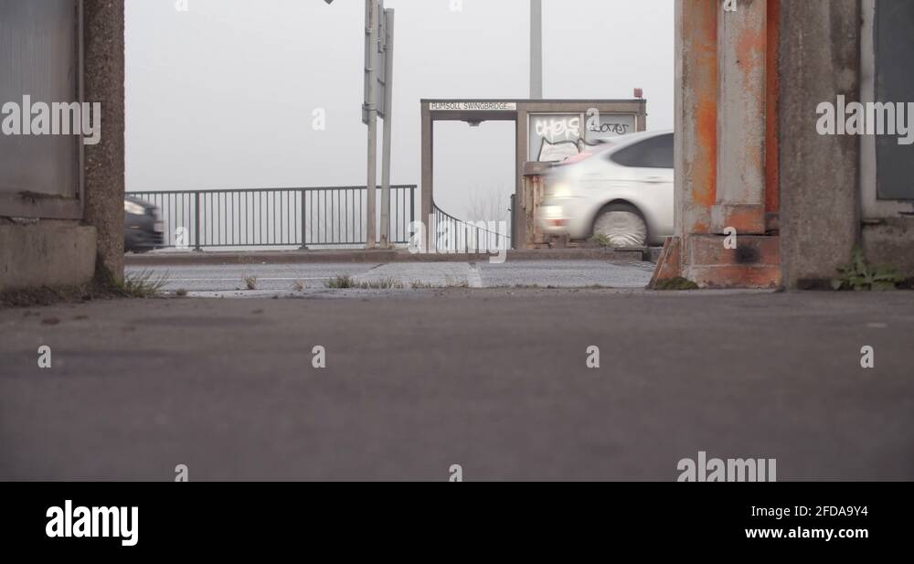 Vehicles passing control room on Bristol (UK) Plimsoll swing bridge on ...