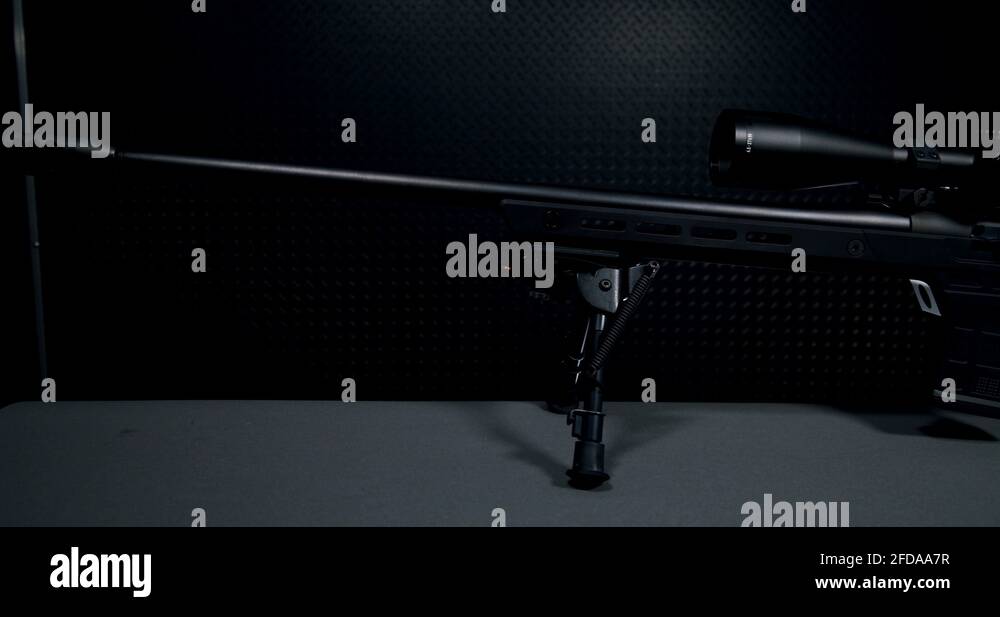 black Sniper Rifle with high powered Scope and ten round Magazine on ...