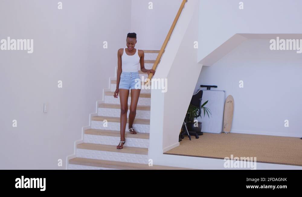 Woman descending stairs Stock Videos & Footage - HD and 4K Video Clips - Alamy