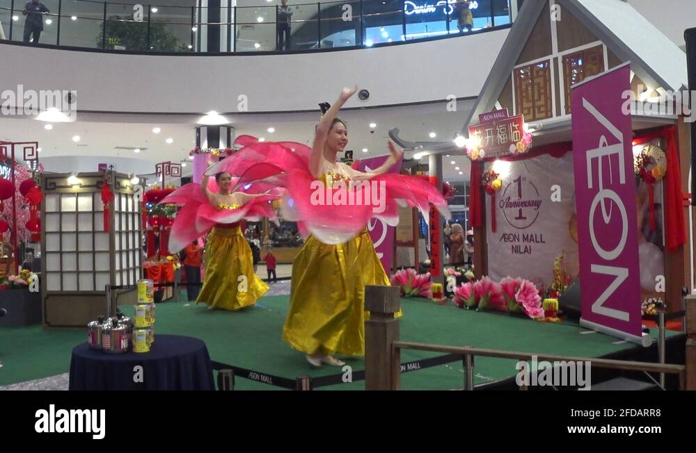 Chinese traditional dance performed inside the huge mall's atrium. The ...