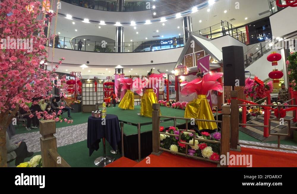Chinese traditional dance performed inside the huge mall's atrium. The ...