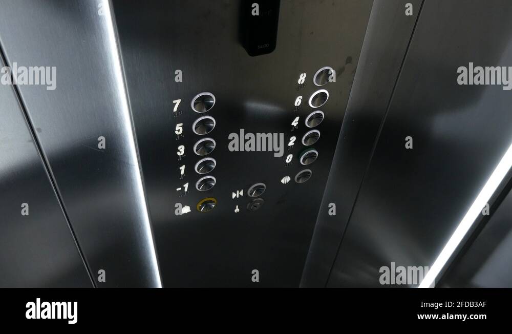Static close up shot inside modern illuminated elevator with eight ...