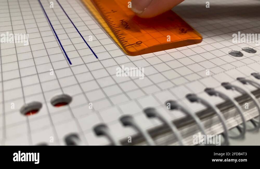 Draw lines with a ruler on a piece of paper in a notepad Stock Video ...