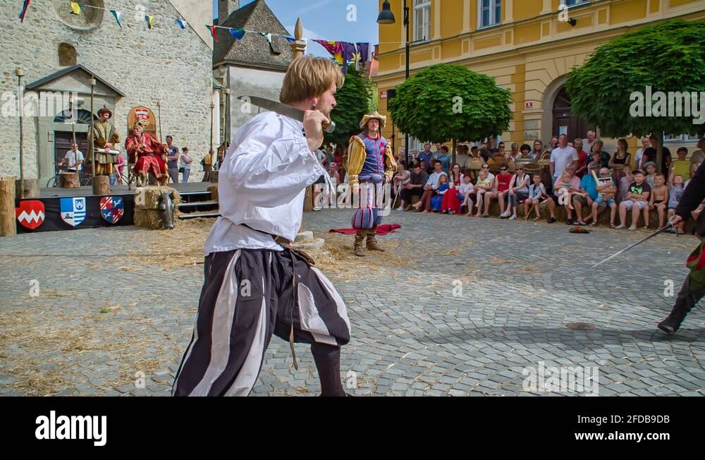 Medieval Sword Fight in Town Square in Front of Crowd, King and Jester ...